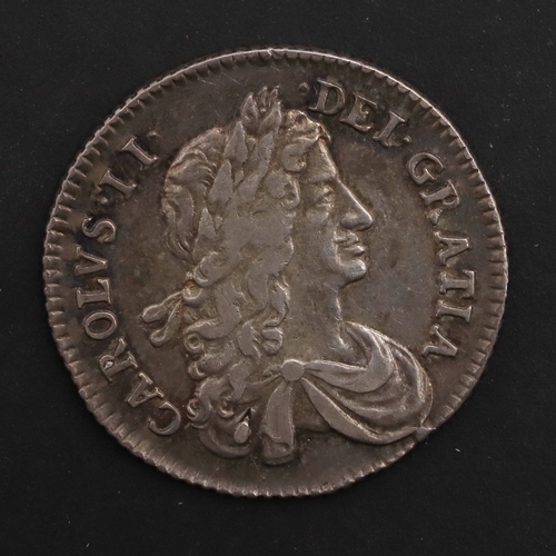 A CHARLES II SHILLING, 1663. A George II Shilling, first laureate and ...