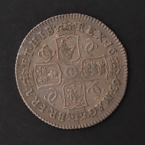 A CHARLES II SHILLING, 1663. A George II Shilling, first laureate and ...