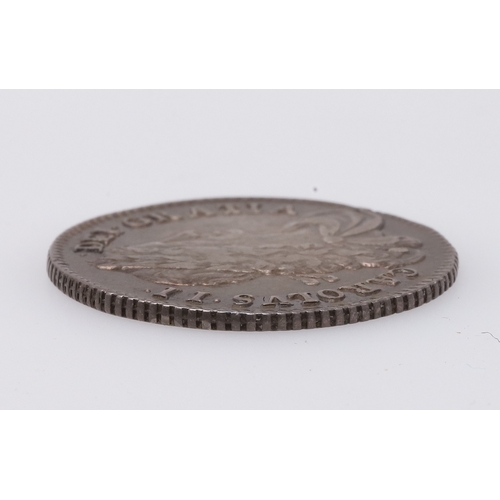 A CHARLES II SHILLING, 1663. A George II Shilling, first laureate and ...