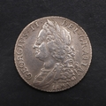 A GEORGE II LIMA SHILLING, 1745. A George II Shilling, old laureate and ...