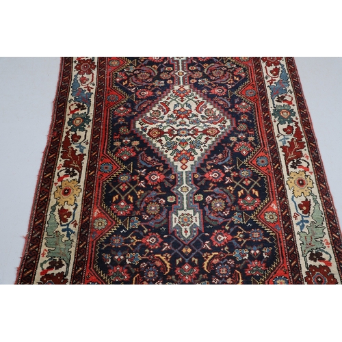 A PAIR OF BIDJAR RUNNERS. Each with a deep Herati field centred by an ...