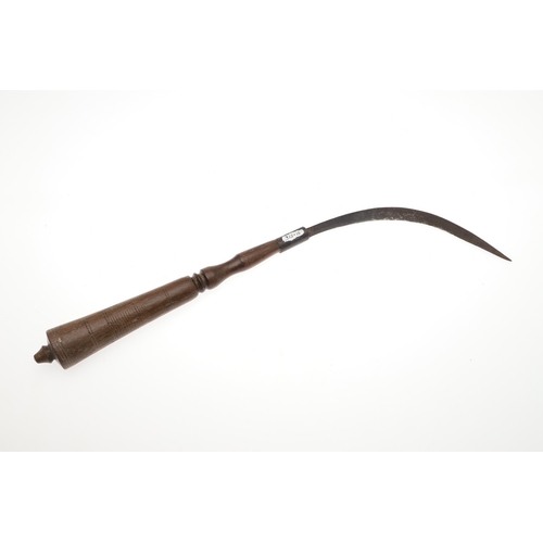 A SMALL RICE HARVESTING SICKLE. A light sickle for harvesting rice with ...
