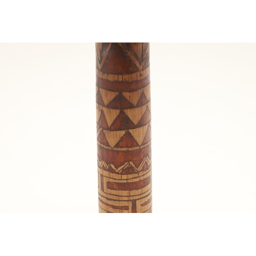 A DECORATIVE MELANESIAN BAMBOO LIME CONTAINER. A cylindrical lime ...