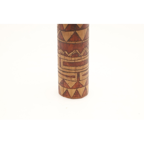A DECORATIVE MELANESIAN BAMBOO LIME CONTAINER. A cylindrical lime ...