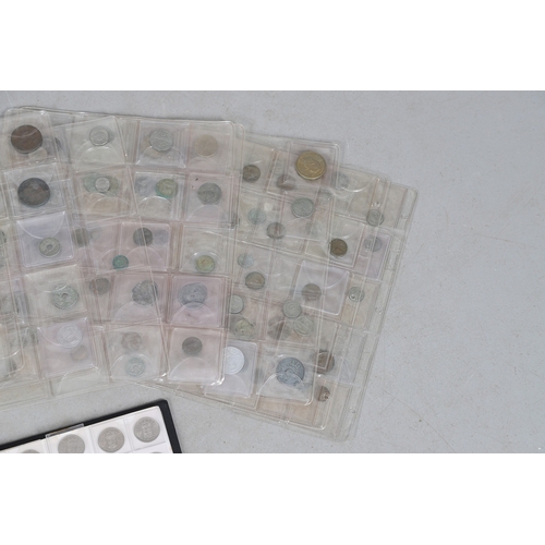 A LARGE COLLECTION OF COINS IN VARIOUS ALBUMS. A large collection of ...