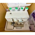A BOXED JANOME 204D OVERLOCKING SEWING MACHINE. INCLUDED WITH FOOT ...