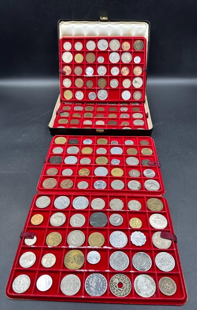 A coin collectors box with four trays of worldwide coins, various ...