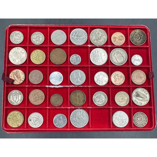 A coin collectors box with four trays of worldwide coins, various ...