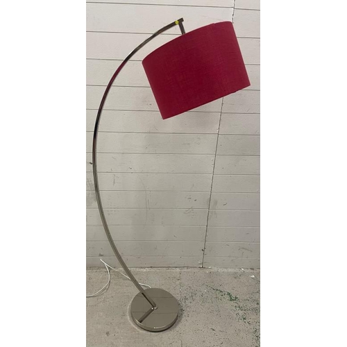 A contemporary floor standing arch floor lamp