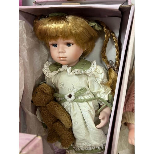 Four large porcelain dolls by The Leonardo Collection to include 