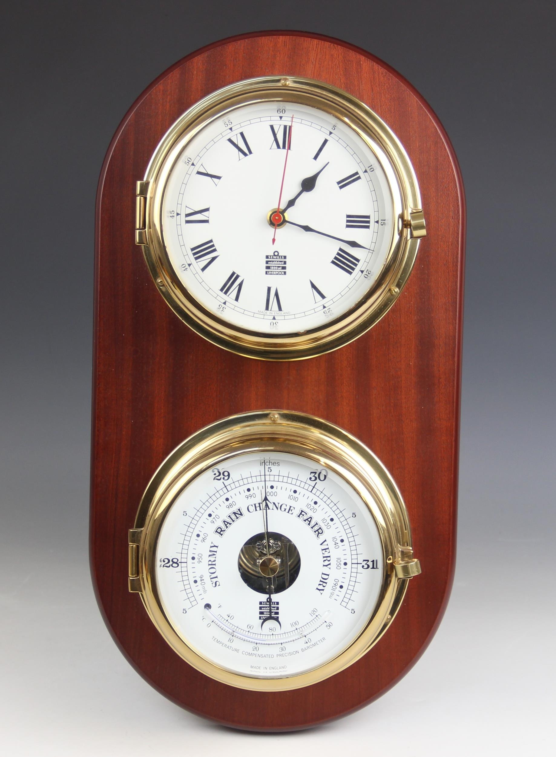 A Sewills of Liverpool brass cased ships wall clock with quartz ...