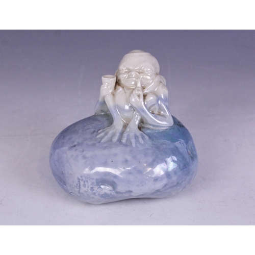 A Royal Doulton Titanian ware grotesque imp, circa 1913, seated on a ...