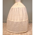 A crinoline frame, circa 1860, labelled 'Colemans Patent Demi Skirt ...