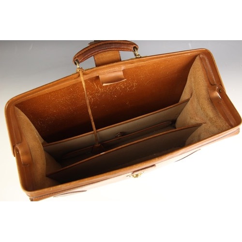 A Church's tan leather briefcase, of traditional design with three ...