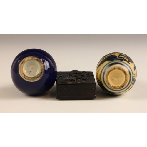 Three Chinese snuff bottles, comprising; a powder blue glazed example ...