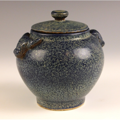 A Chinese Jun ware jar and cover, of bulbous form and mounted with two ...
