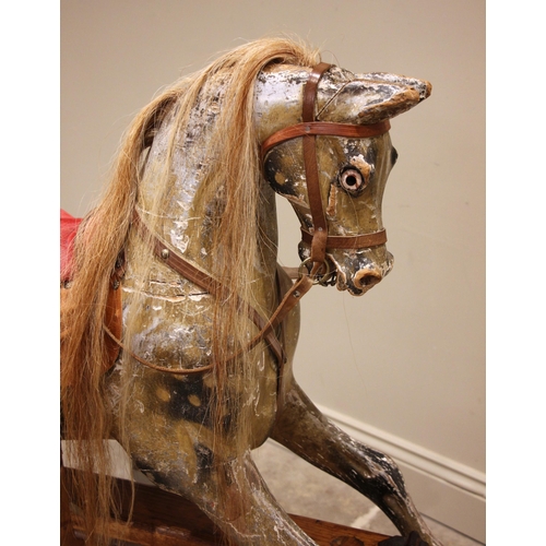 A late 19th century dappled dun rocking horse, retailed by Hamleys ...
