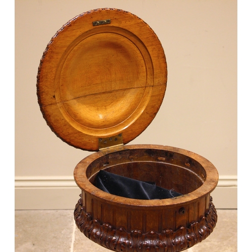 A Victorian oak Puginesque teapoy, the hinged drum shaped top with a ...