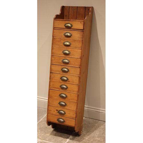 A pine wall hanging chest, constructed with twelve drawers, each ...