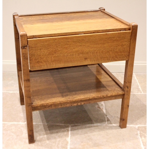 An estate made oak work table, 20th century, the upper tier with a ...