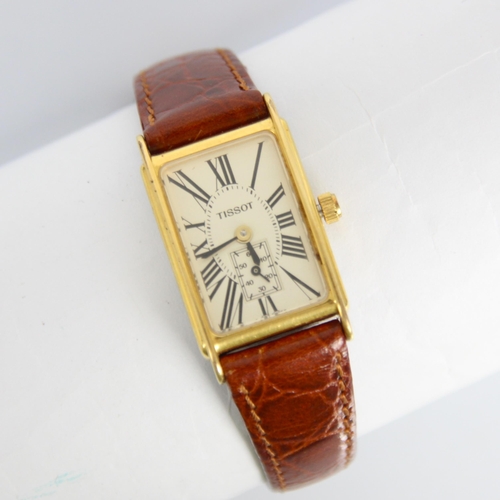 A ladies Tissot 'tank' style quartz wristwatch, the rectangular dial ...