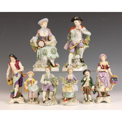 A pair of Sitzendorf porcelain figures modelled as a shepherd and ...