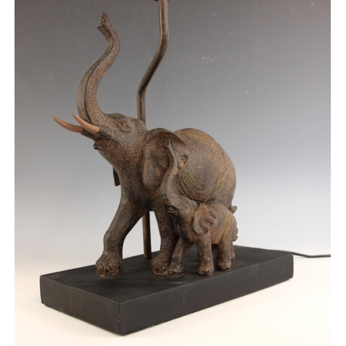 A contemporary composite table lamp base, modelled as an elephant and ...
