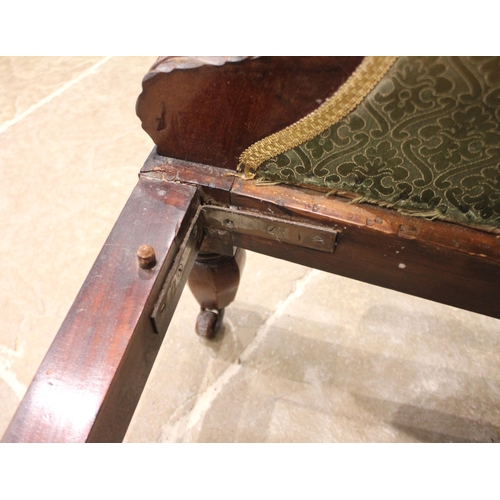 A Victorian mahogany club armchair, the padded backrest with scrolled ...