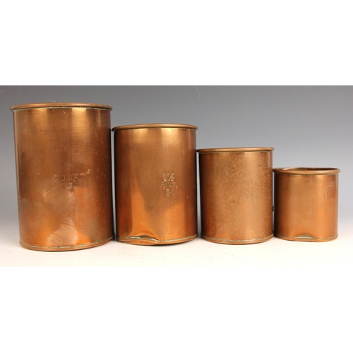 A graduated set of four Victorian copper cylinder measures, comprising ...