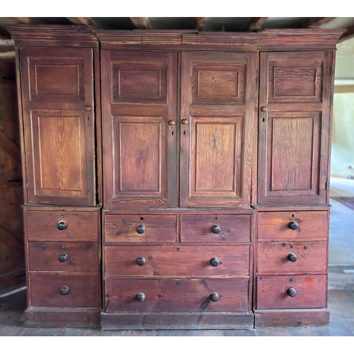A large George III pine farmhouse housekeeper’s cupboard, the ...