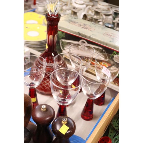 Red cut glass decanter with 6 red stemmed wine glasses