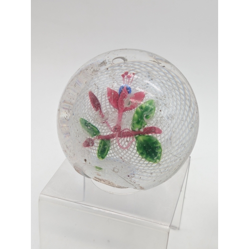 A collection of glass paperweights and decorative glass, including ...