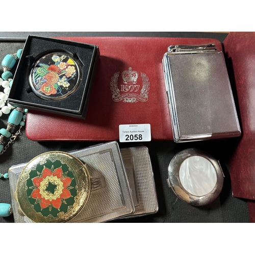 Collection of items including cigarette cases, decorative compacts and ...