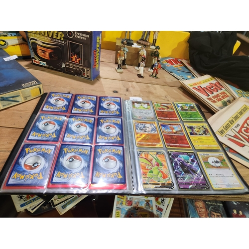A Pokemon card collector's folder complete with 90 assorted Pokemon cards