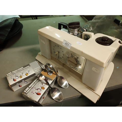 A goblin teasmade together with a selection of quirky spoons