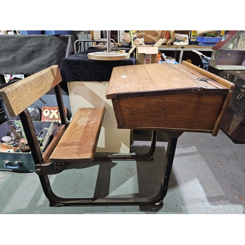 Antique wooden school desk with attached seat and lift up writing surface