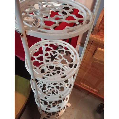 Antique Six tier cast iron pan stand would be great as a plant stand ...
