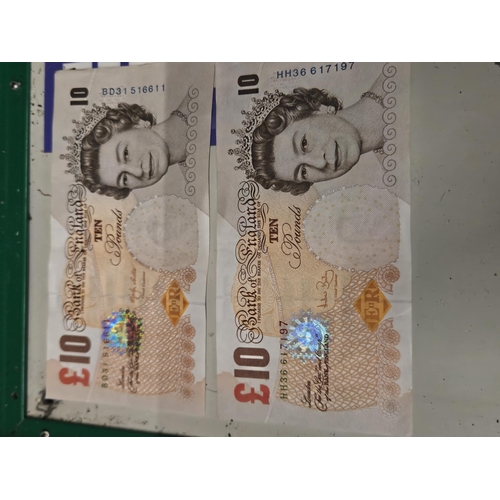 two old Bank of England £10 banknotes featuring Queen Elizabeth II.