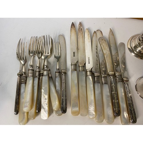 Quantity of hallmarked silverware including napkin rings, cutlery and vase.