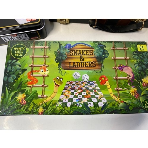Vintage games compendium in case with snakes and ladders, dominoes and ...