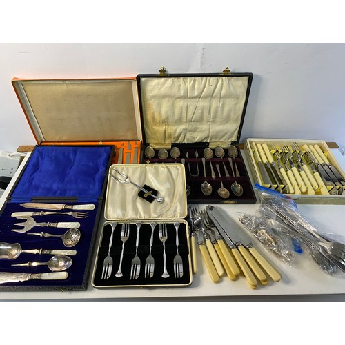 Assortment of vintage and modern cutlery including boxed sets.