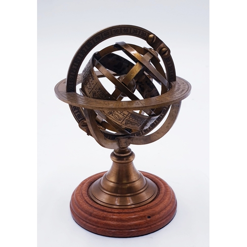 BRASS FRAMED 13cm ARMILLARY With CRYSTAL SPHERE MOUNTED ON A WOODEN PLYNTH