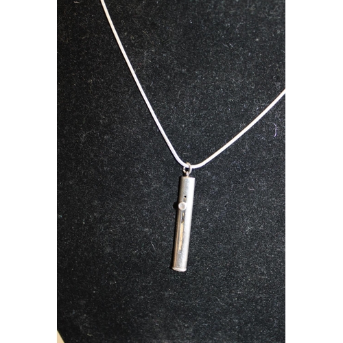 A hallmarked silver dance card pencil on chain