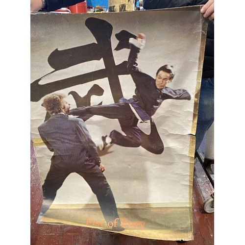 A selection of Bruce Lee posters and other items