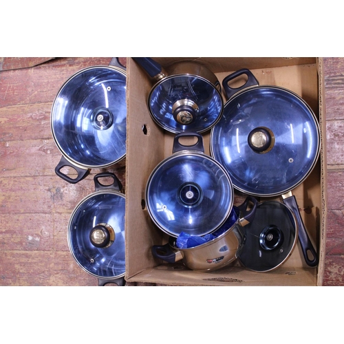 An assortment of 'Happy Lady' kitchen pans, shipping unavailable