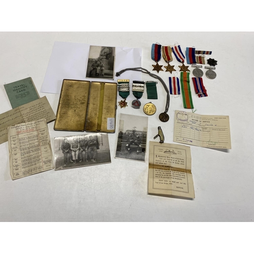 A selection of WW2 ephemera including medals a German propaganda pound ...