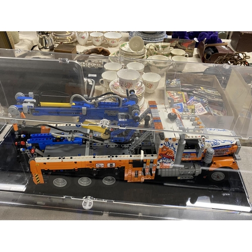 A Lego Technic Heavy Duty Tow Truck model 42128 in display case, with ...