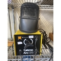 A Cosmo Arc 150 welder (untested) and welding mask. No shipping