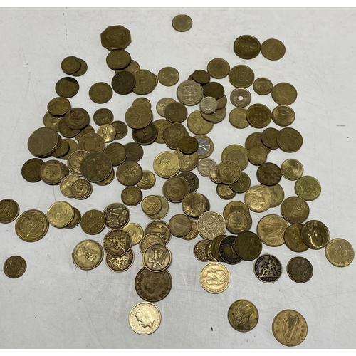 A box of foreign brass coins