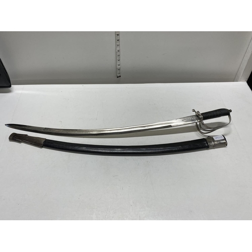 An Indian cavalry sword in scabbard, shipping unavailable